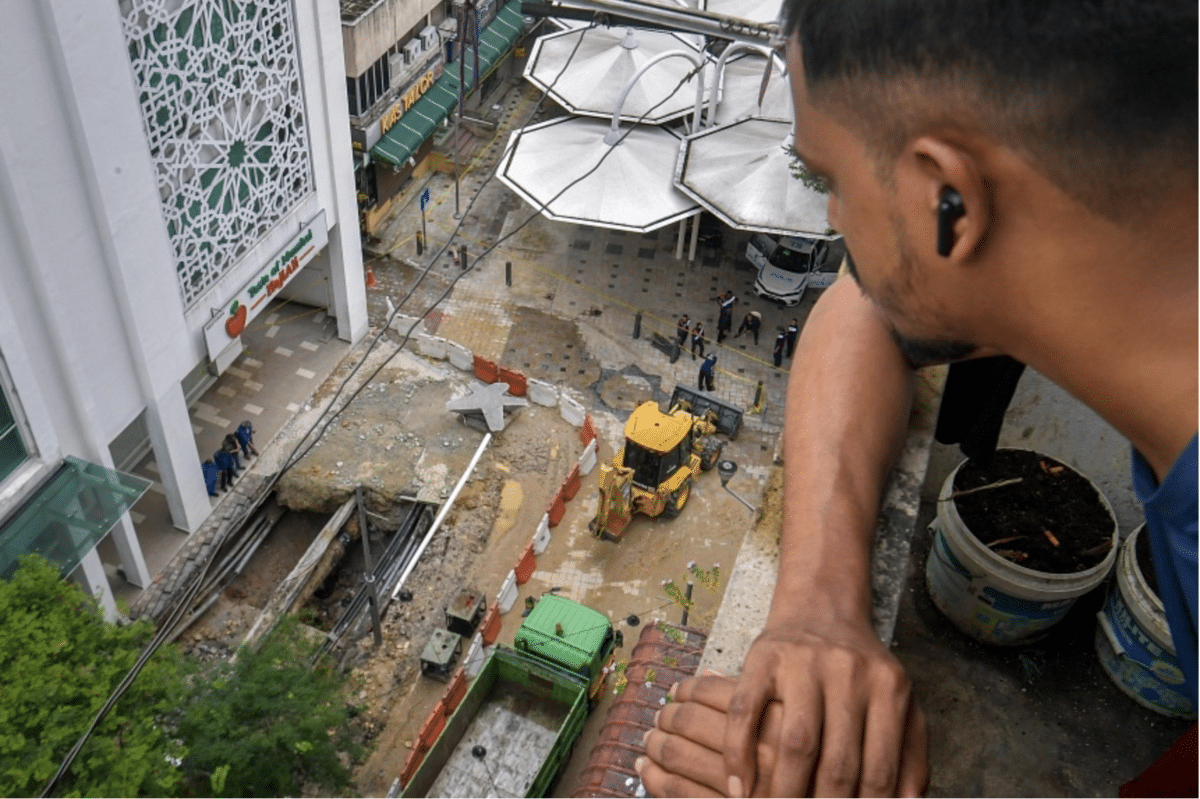 Tourist swallowed by sinkhole in Kuala Lumpur, search continues