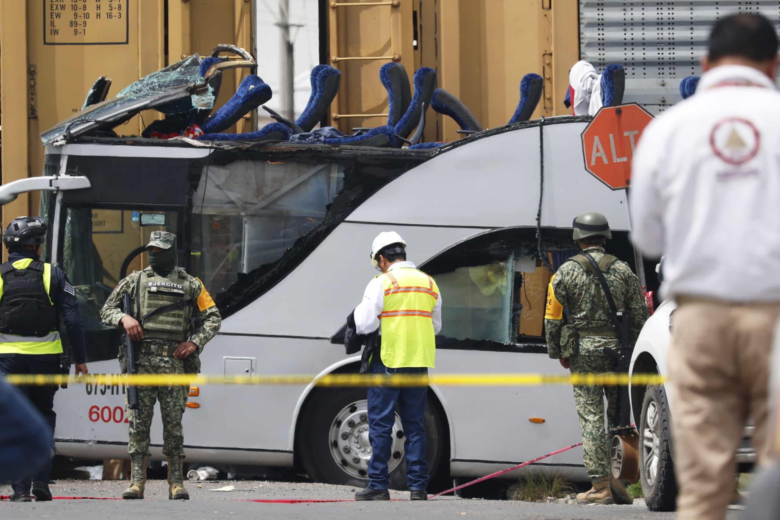 Freight train slams into a bus outside Mexico City, kills 8 people